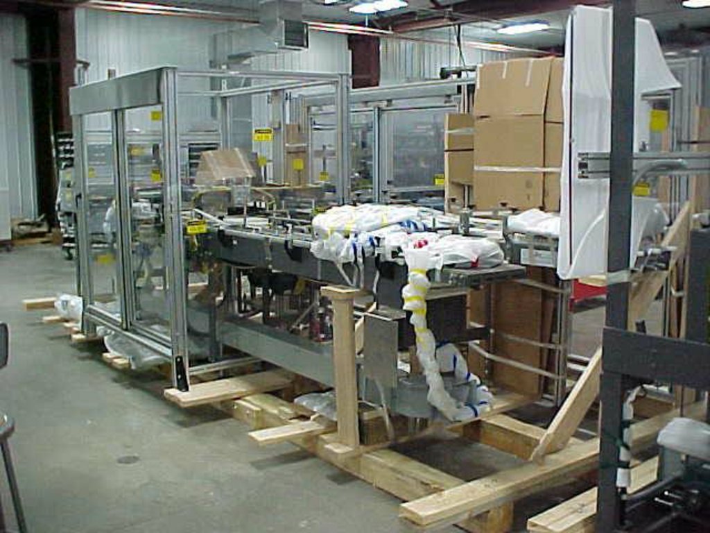 Used Brenton TLKDCP Case Packer for Clam Shell Trays